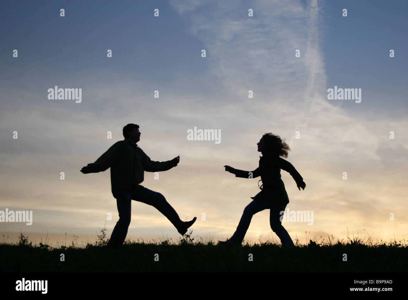 run couple silhouette Stock Photo - Alamy