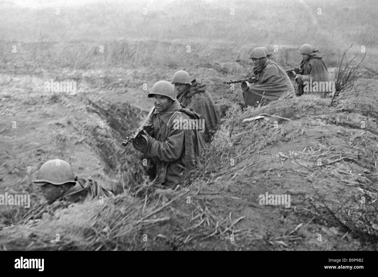 Soldiers moving along a trench Stock Photo - Alamy