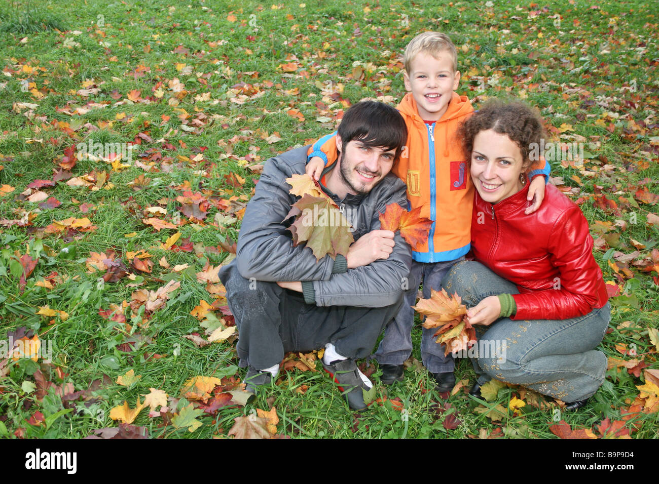 autumn family with stand boy Stock Photo - Alamy