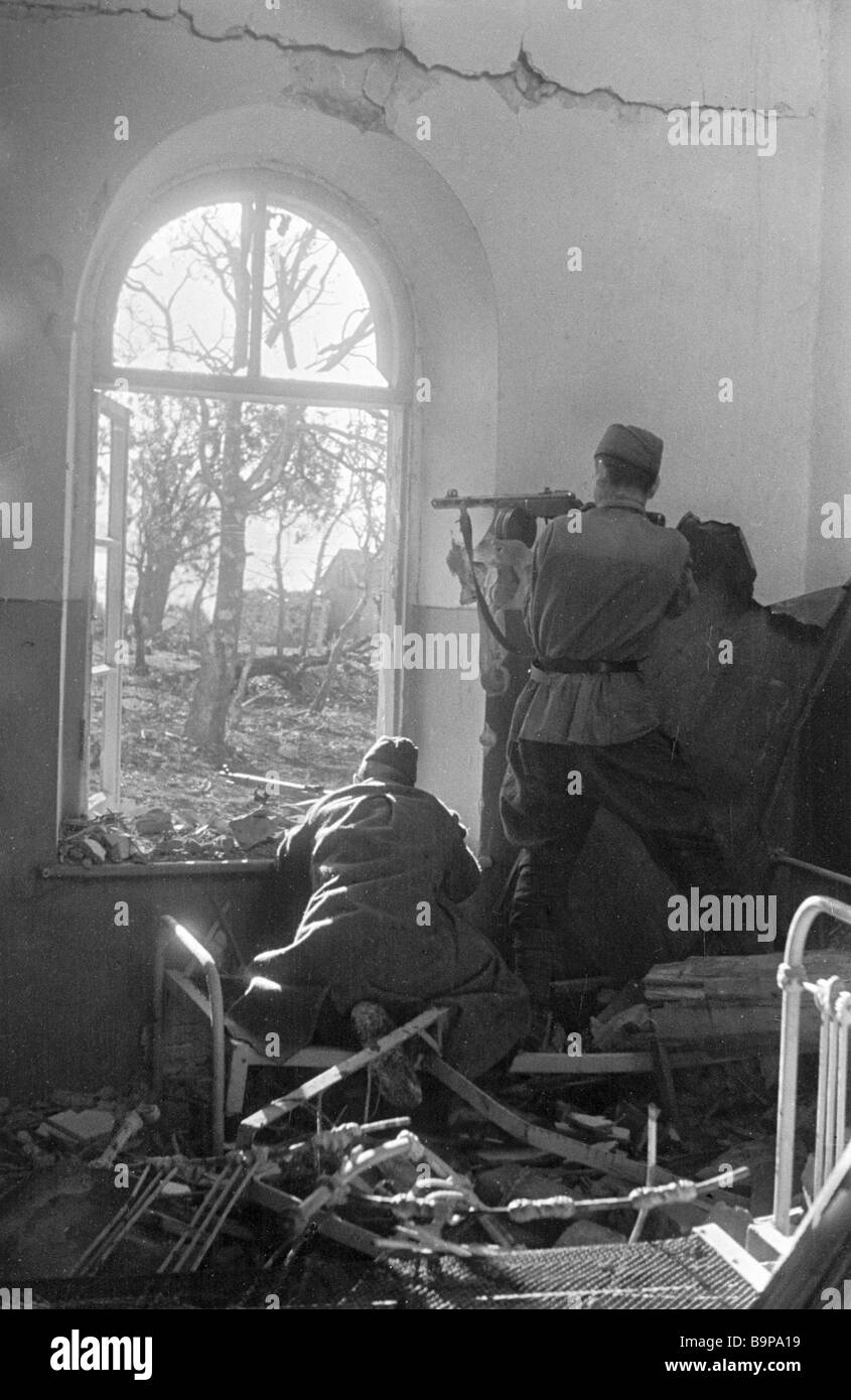Soldiers firing at the enemy from a window in Novorossiisk s outskirts ...
