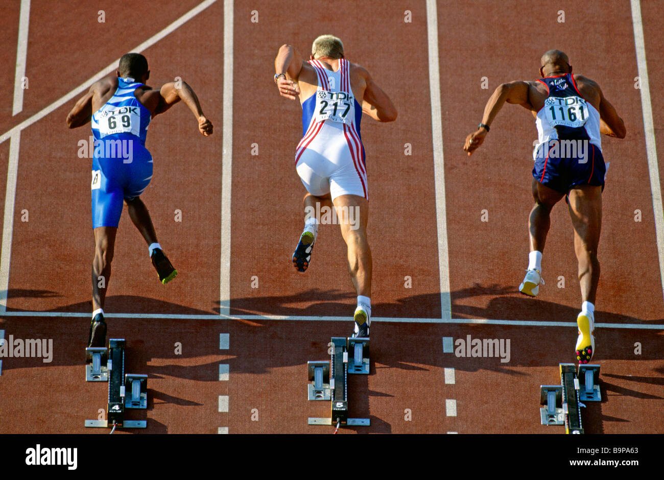 athletics sprint start starting blocks quick reaction Stock Photo - Alamy