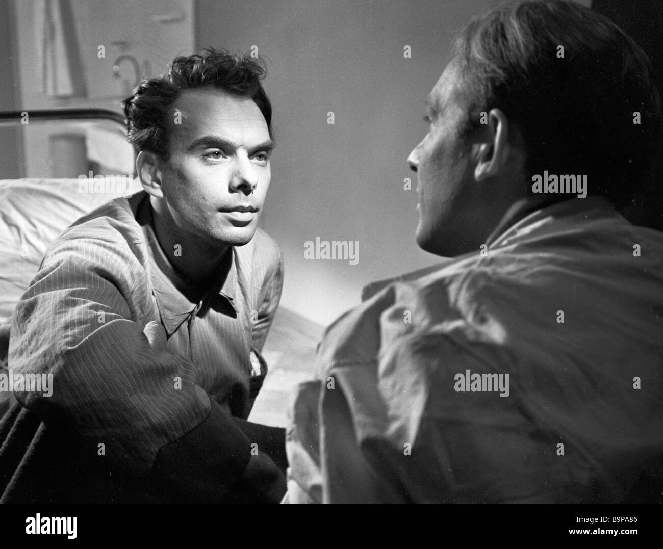 Alexei Batalov as Gusev left and Innokenty Smoktunovsky as Ilya in the film Nine Days of One ...