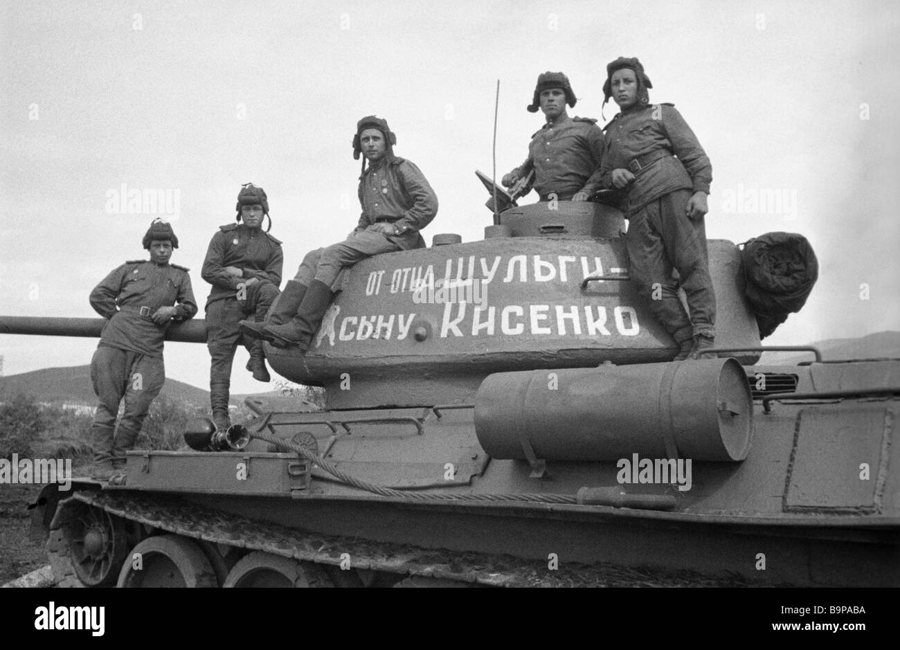Soldiers sitting on a tank purchased by Soviet citizen Shulga The ...