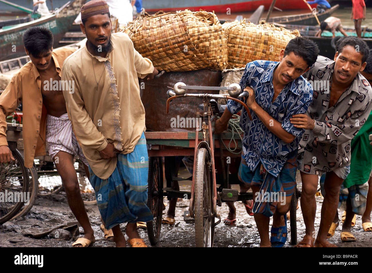 rickshaw men hard work hauling pulling Stock Photo - Alamy