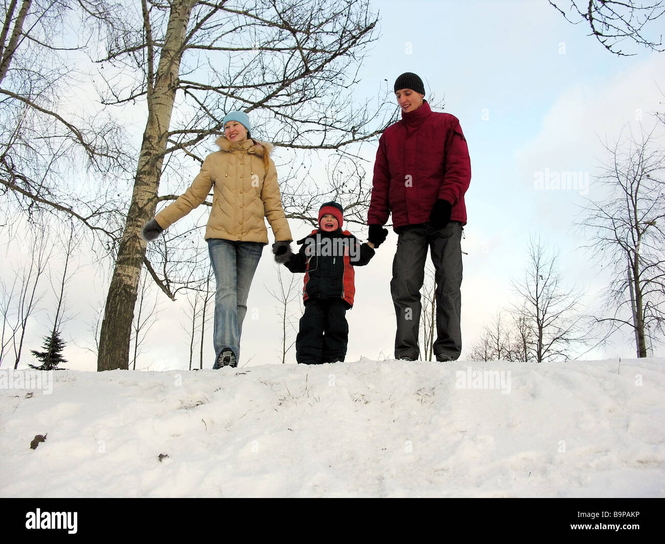 family of three . winter Stock Photo - Alamy