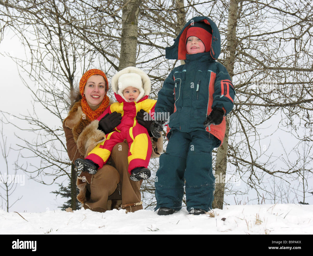 mother with children. winter Stock Photo - Alamy