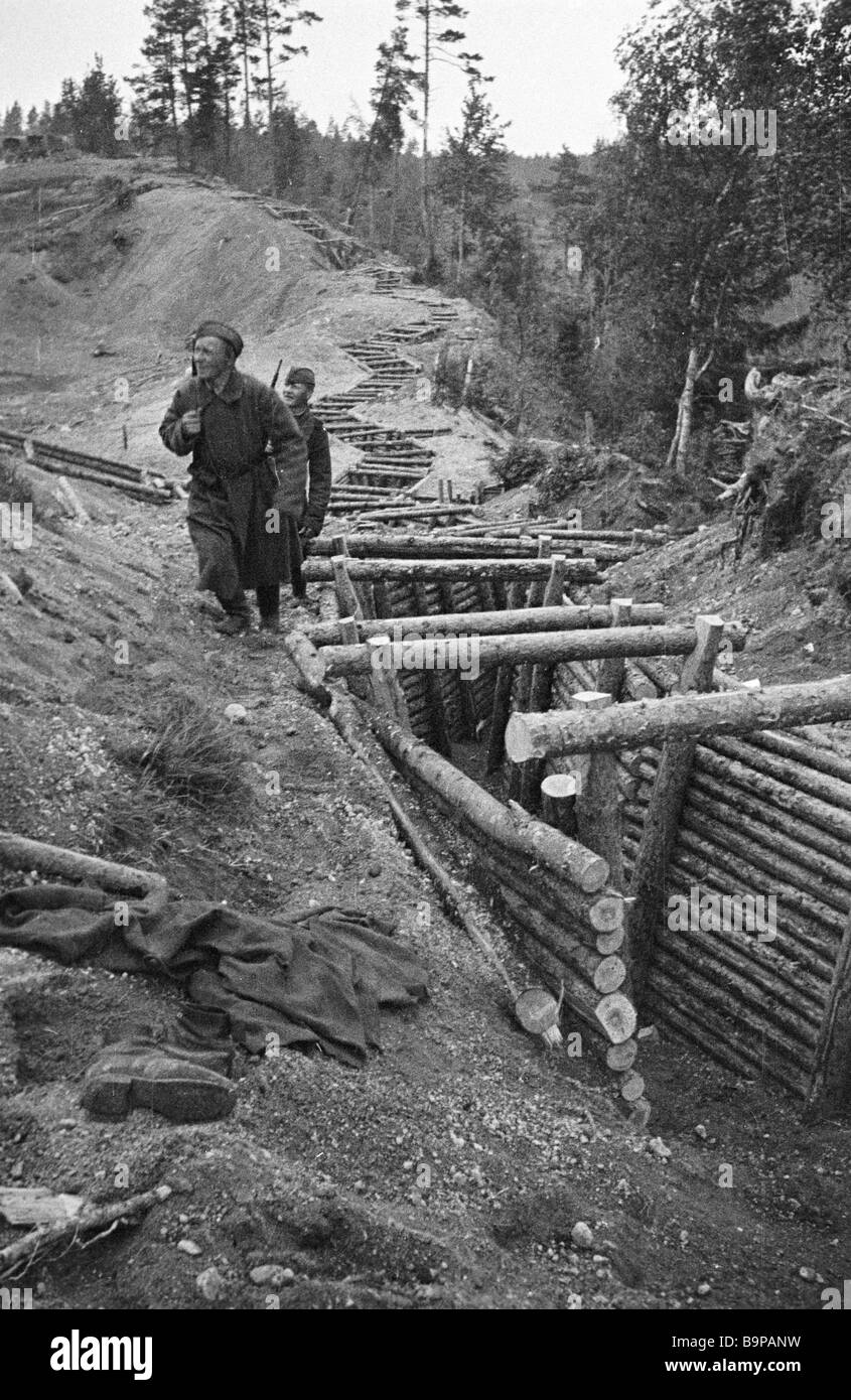 Soldiers passing by a trench Stock Photo - Alamy