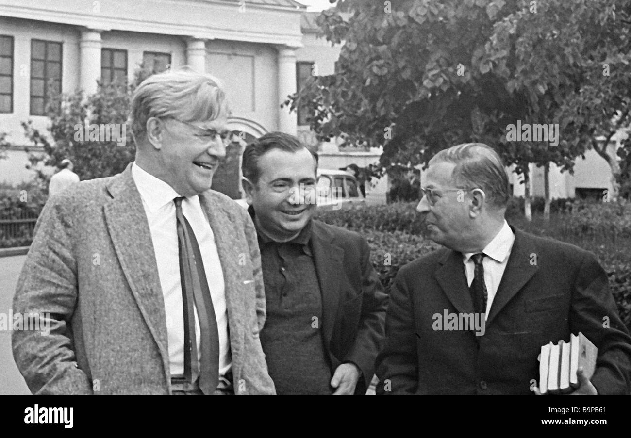French playwright Jean Paul Sartre right talking to poet Alexei Surkov ...