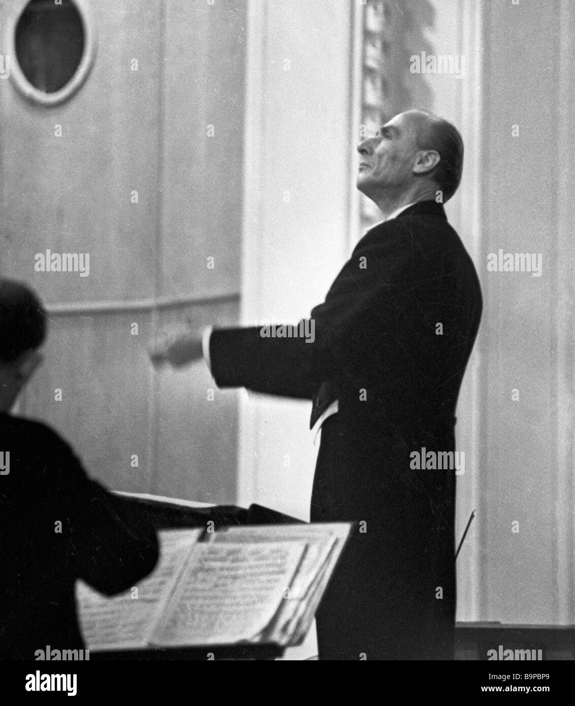 Yevgeny Mravinsky conduction the symphony orchestra Stock Photo - Alamy
