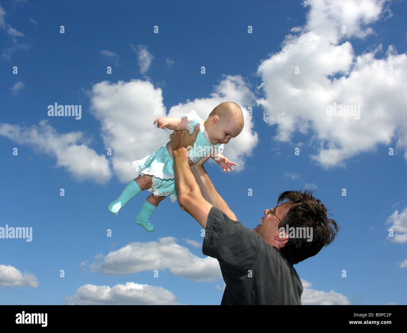 father with baby in sky Stock Photo - Alamy