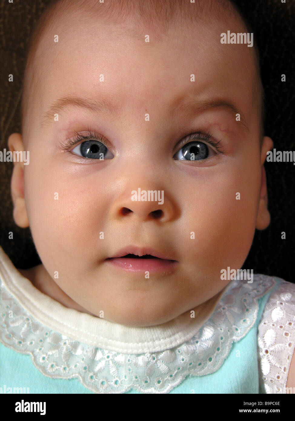 baby looks upwards Stock Photo - Alamy
