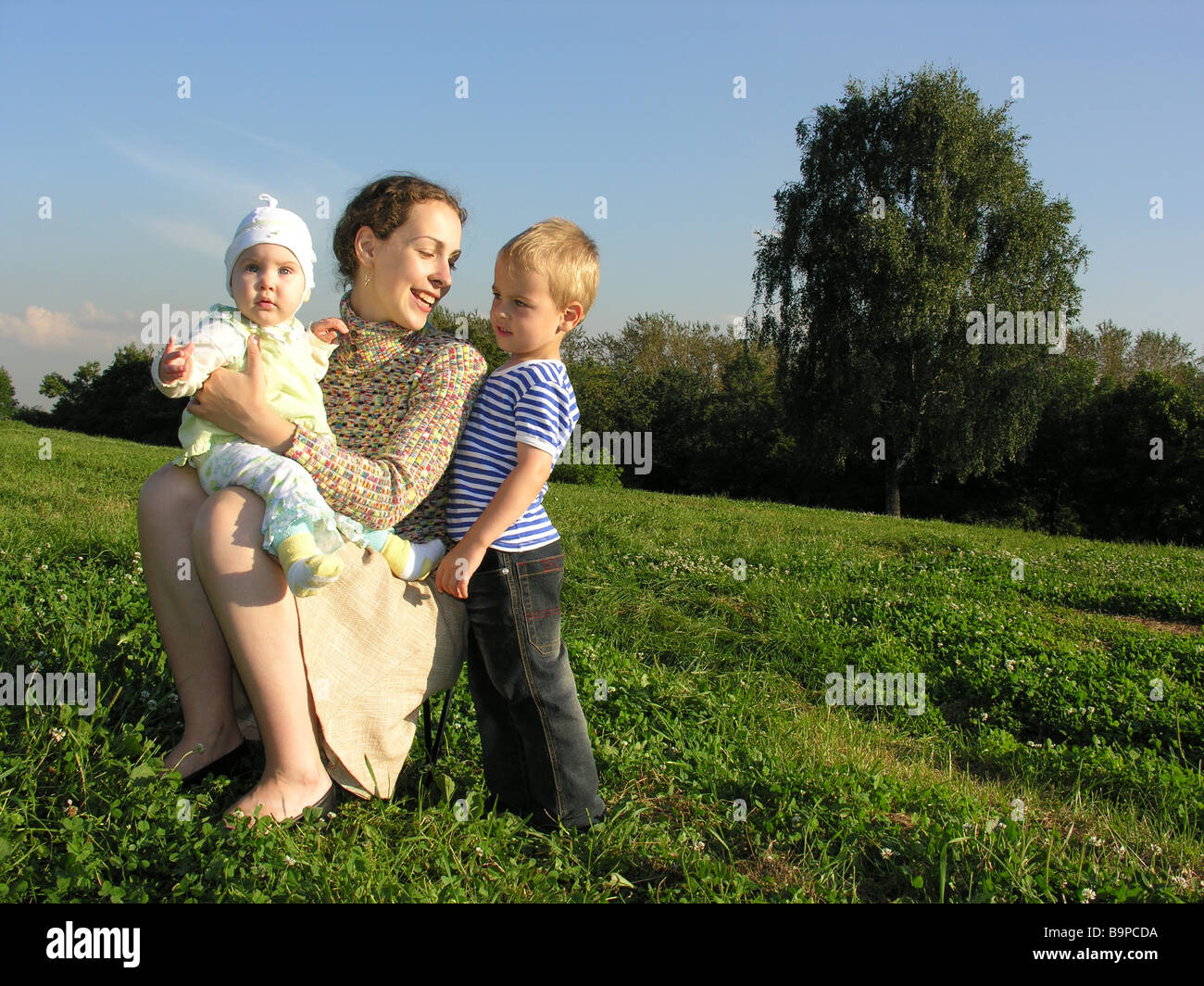 mother with children tree Stock Photo - Alamy