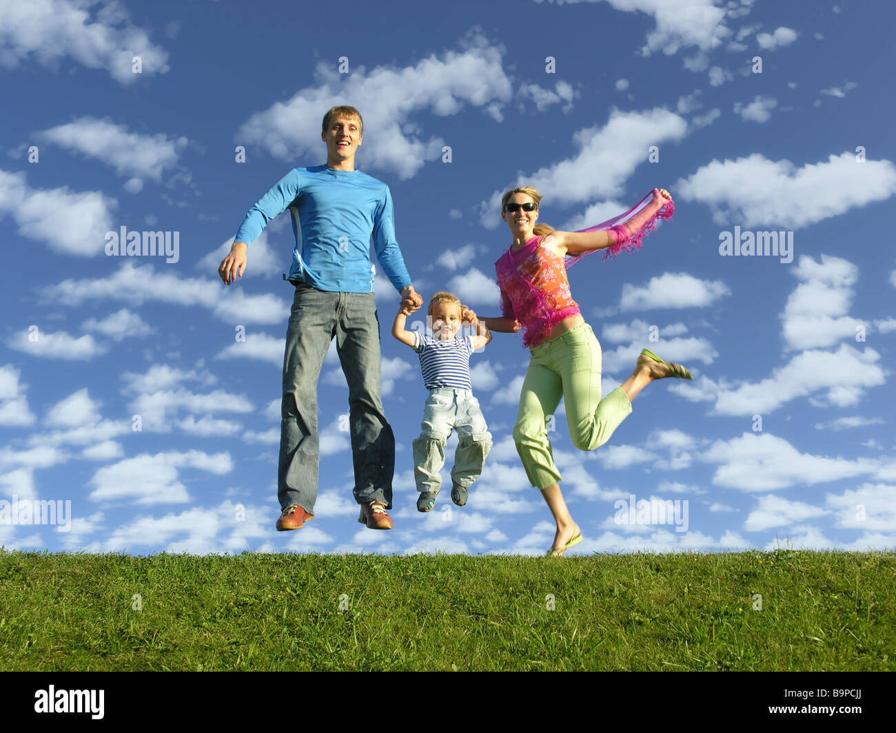 fly happy family on blue sky with clouds Stock Photo - Alamy