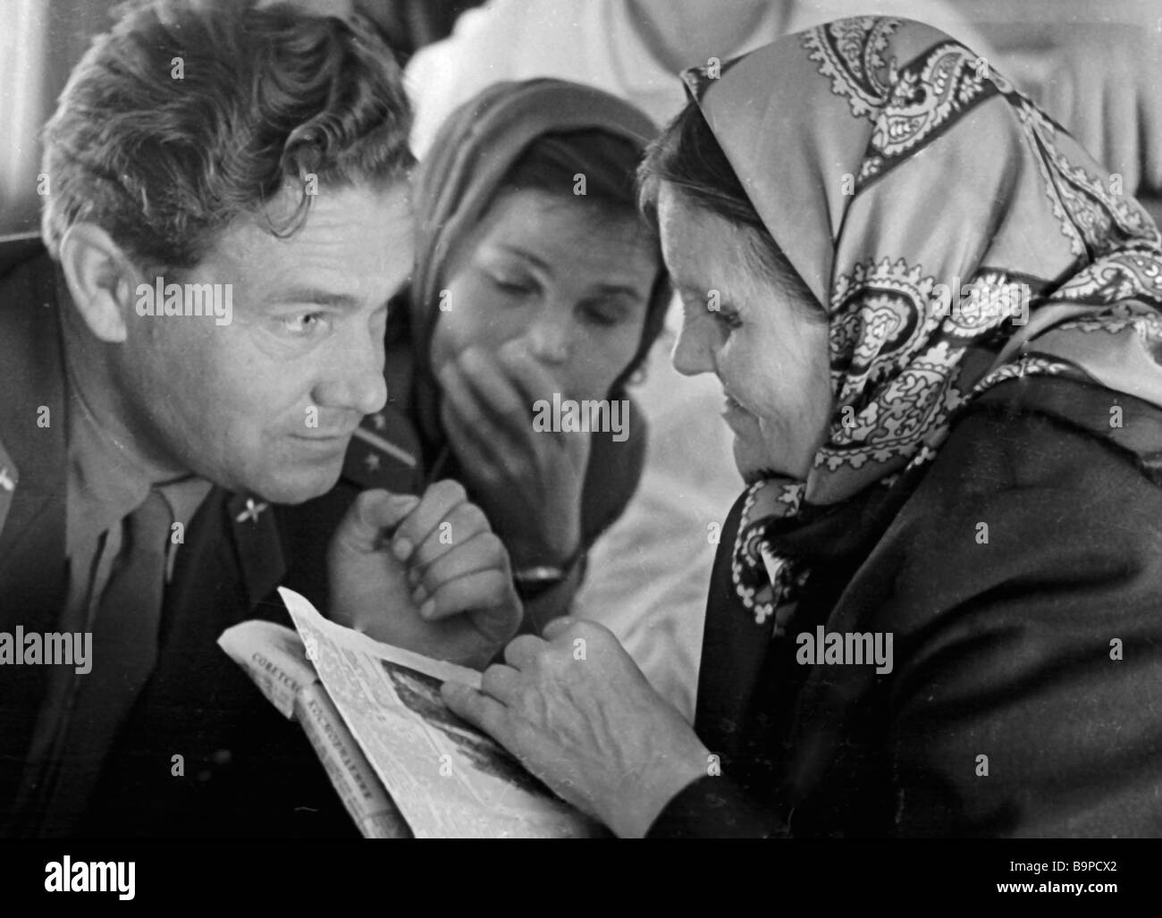 Pilot Ivan Bychkov left explains space flight sequence to Anna ...