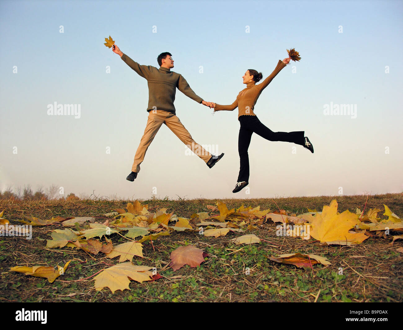 jump couple autumn leaves Stock Photo - Alamy jump couple autumn leaves Stock Photo - Alamy