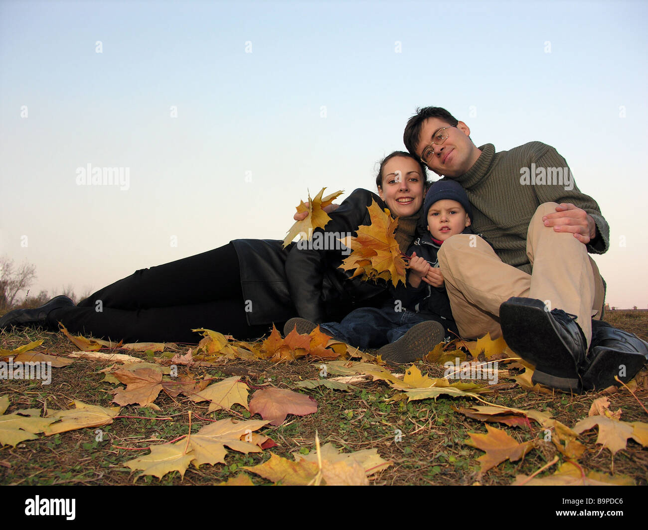 family with autumn leaves Stock Photo - Alamy