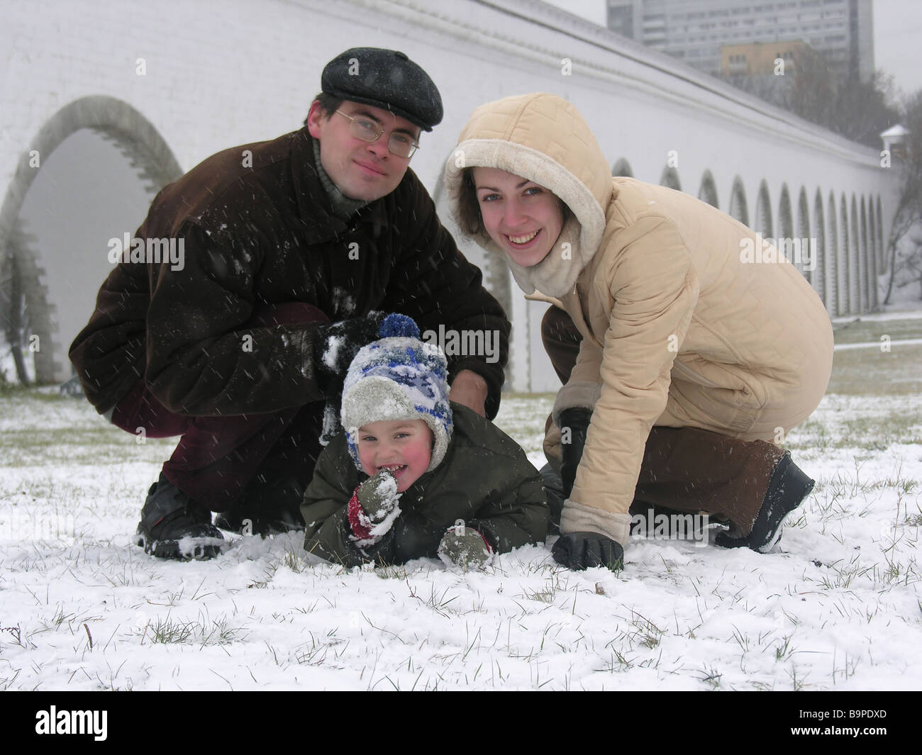 family of three. snow Stock Photo - Alamy