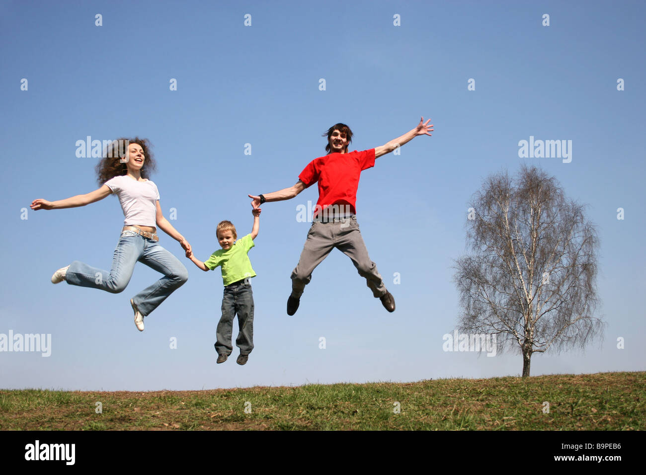 jumping family. spring Stock Photo - Alamy