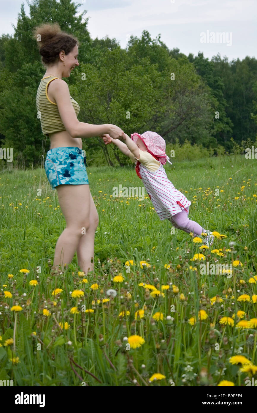 mother rotate baby Stock Photo - Alamy