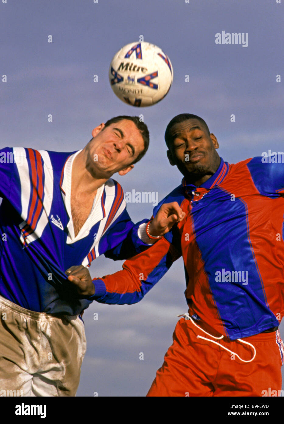 football soccer header heads ball action sports Stock Photo - Alamy