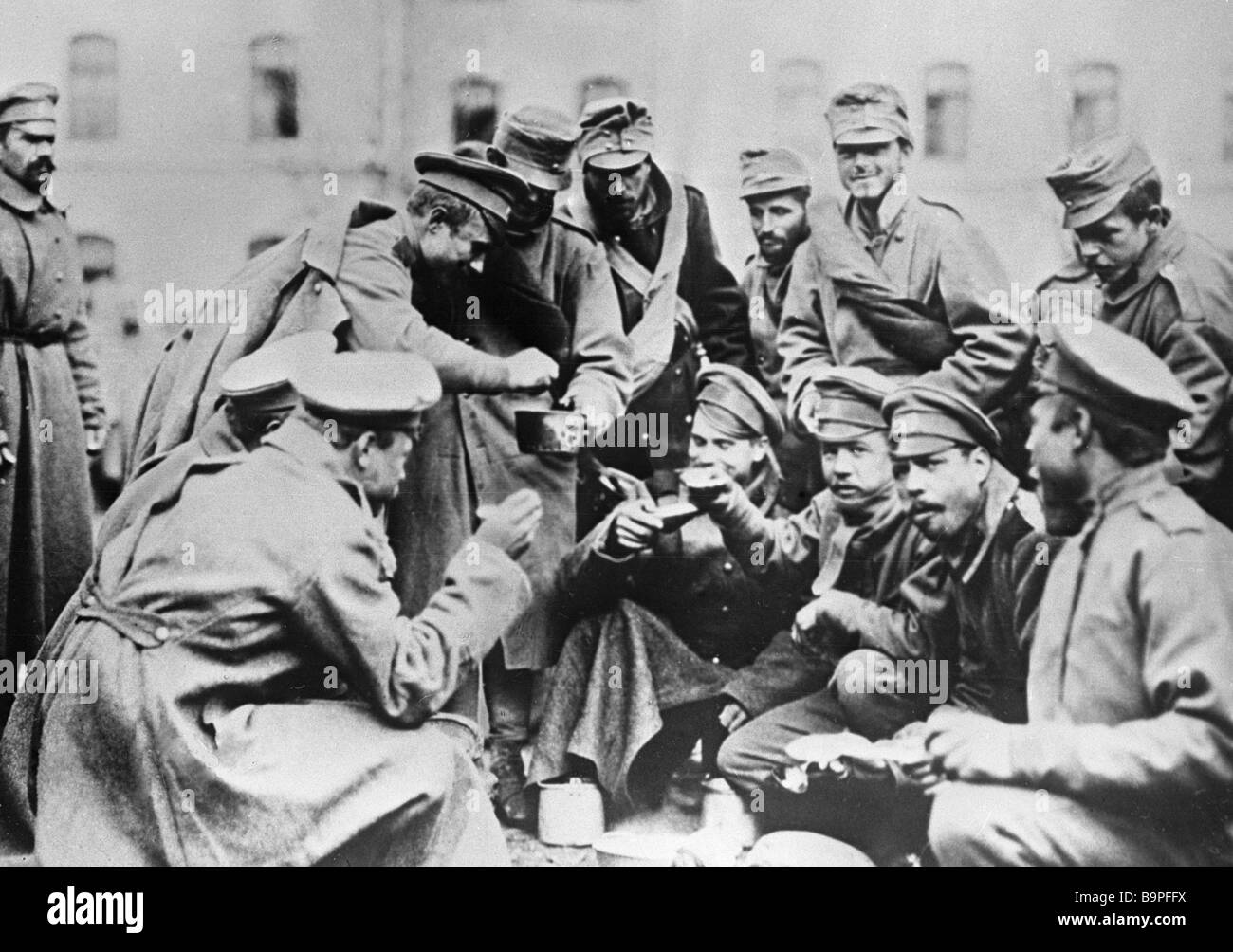 Russian soldiers pouring some soup for an Austrian on the Russian ...