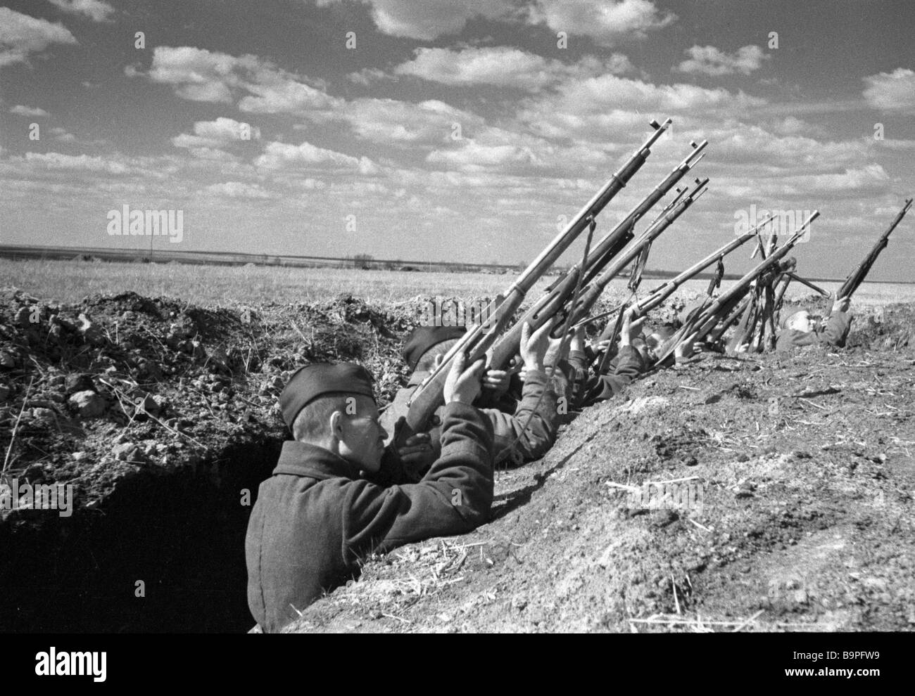 Soviet soldiers firing rifles at a Nazi plane The Kursk Bulge Stock ...