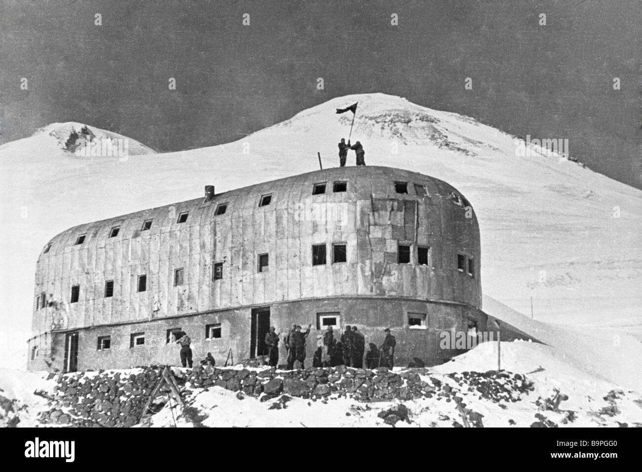 Soldiers raising the Soviet flag on the Priyut 2 station on Mount ...