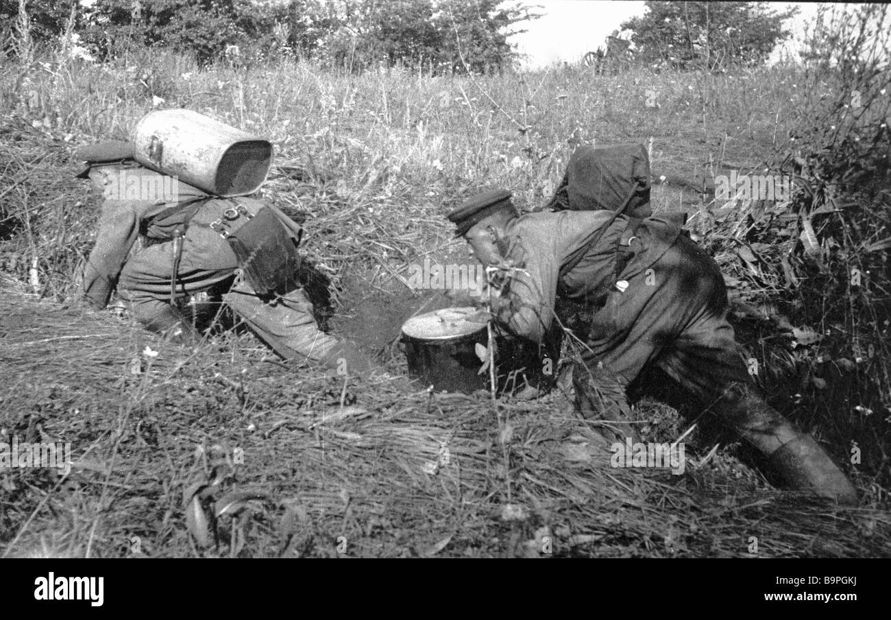 Soldiers M Kuzmin and R Borbash carrying food to the front line Stock ...