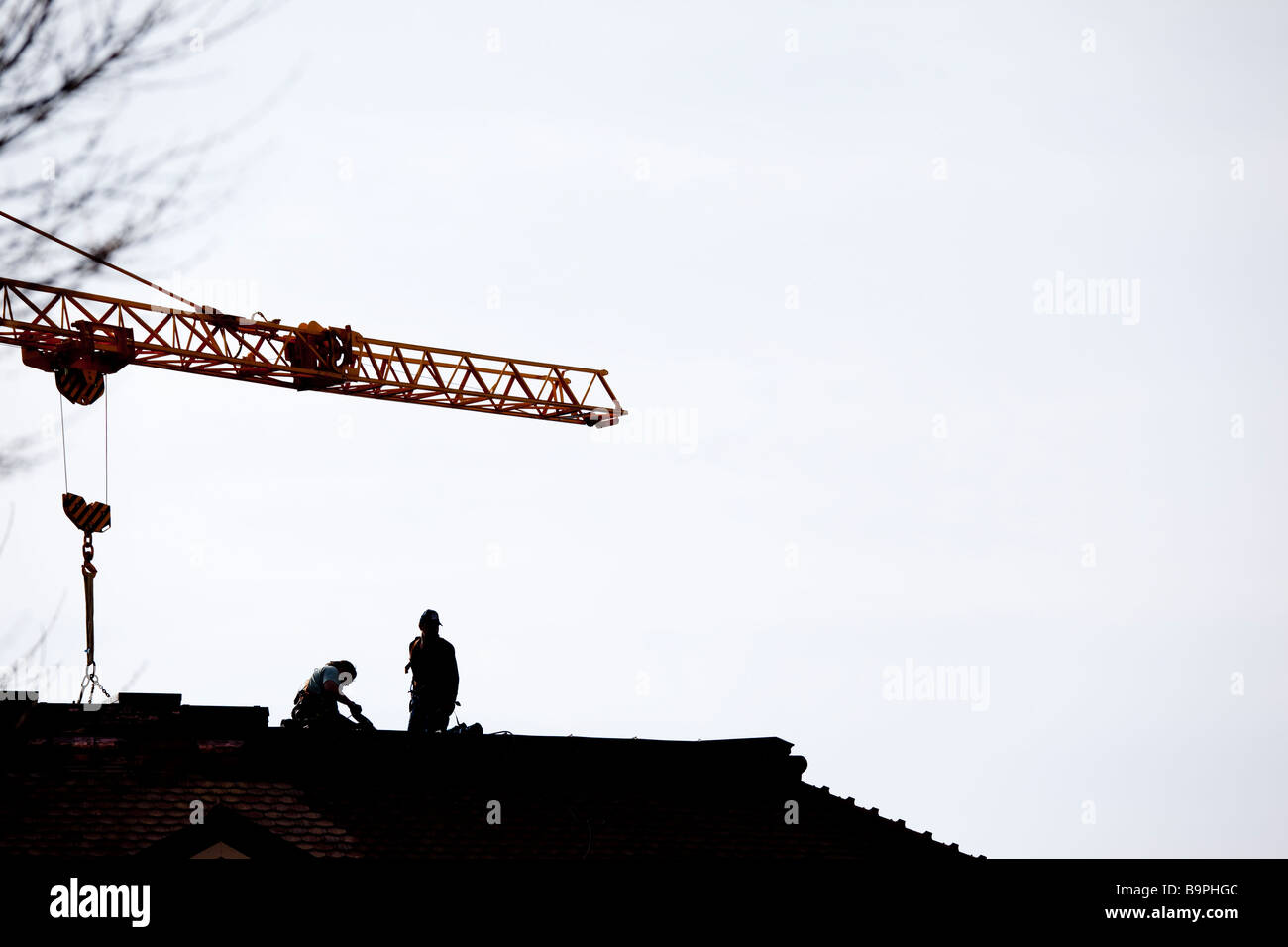 Abstract image of construction workers working on rooftop Stock Photo ...