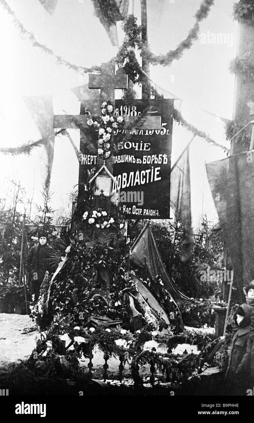 Flowers wreaths banners and posters at the grave of the 9th of January ...