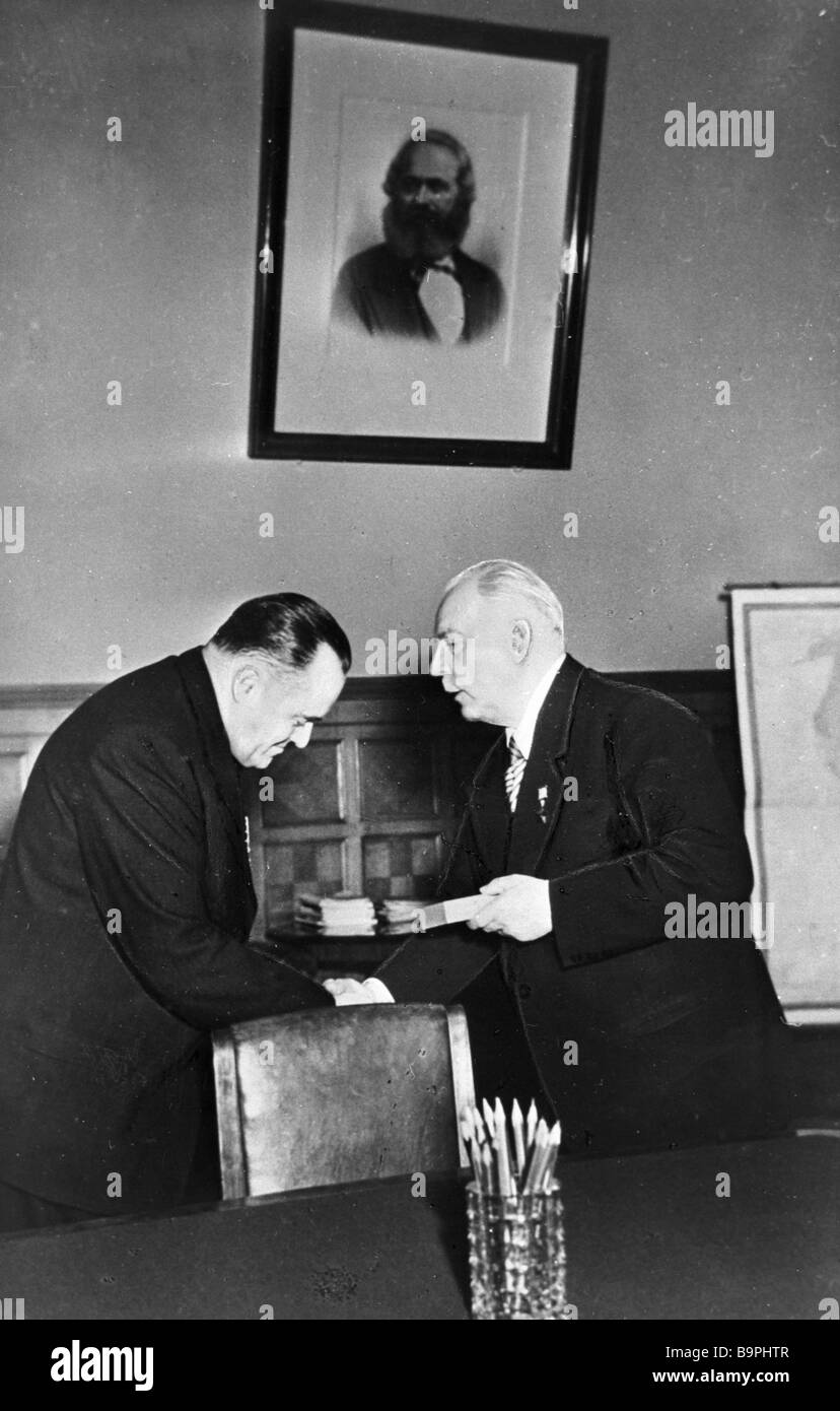 Kliment Voroshilov handing the Order of Lenin to Sergei Korolyov Stock ...
