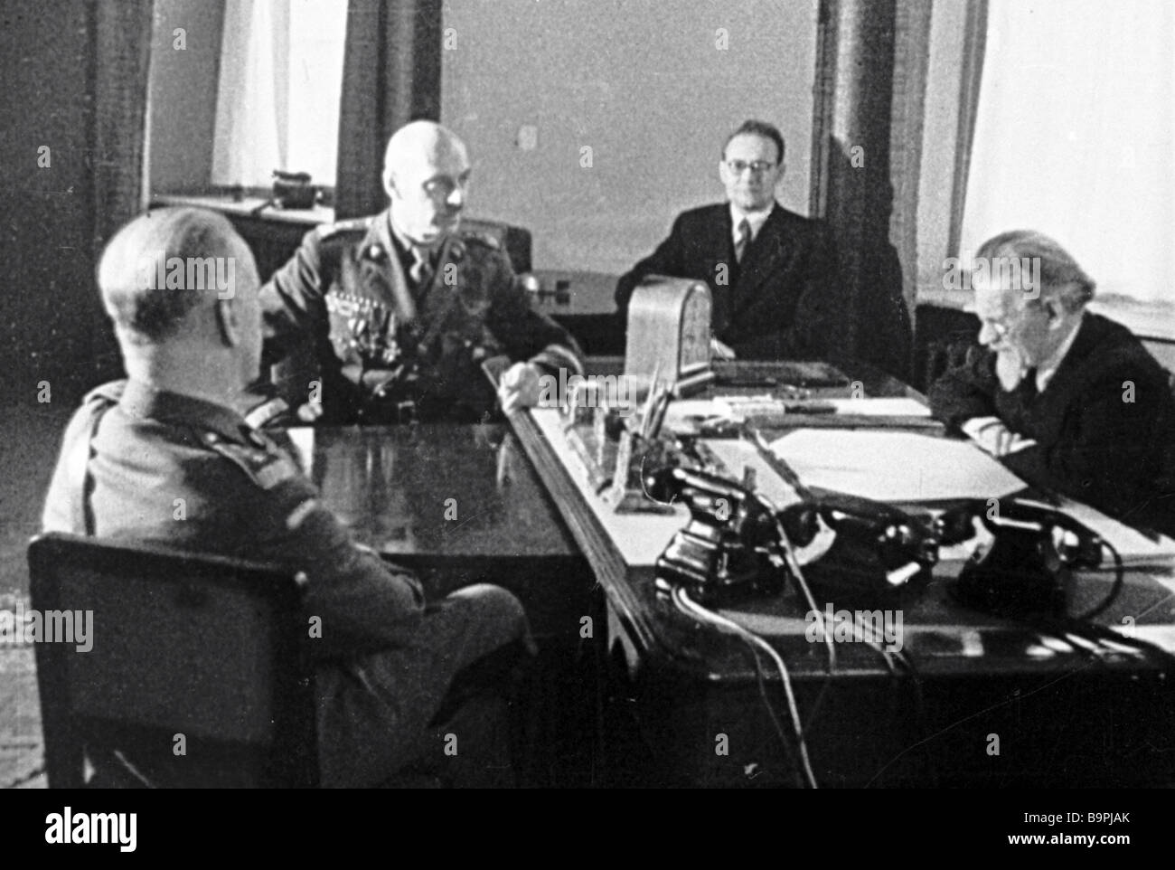 Head of state Mikhail Kalinin first from left receiving Polish military ...