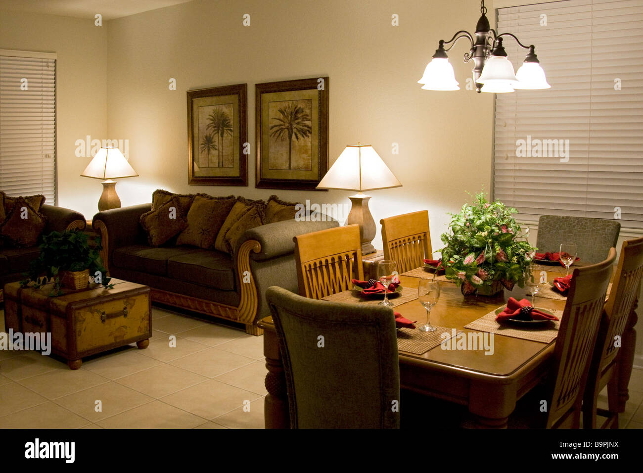 Living room with cushions on couches with coffee table and adjoining ...
