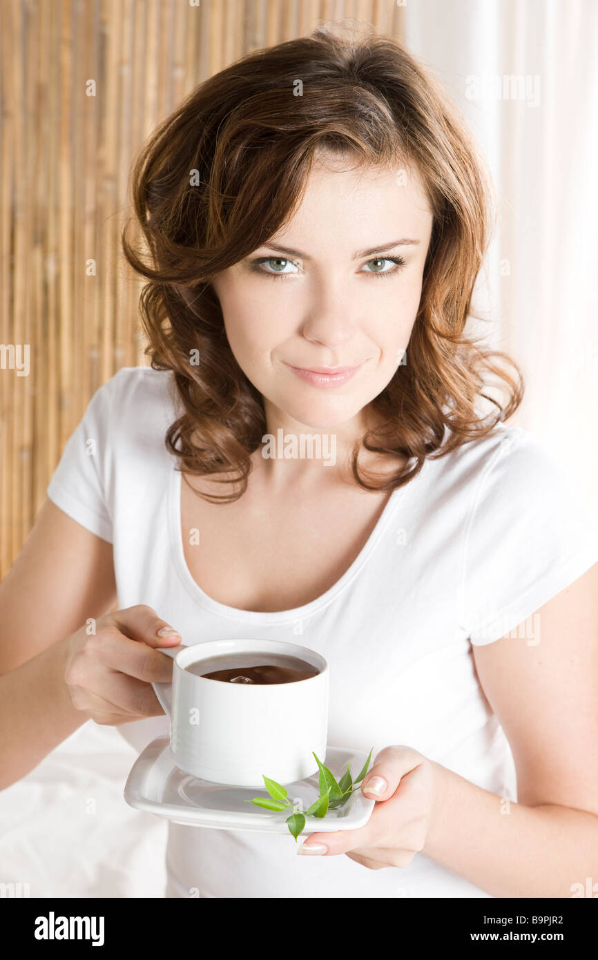 Woman green tea eye contact hi-res stock photography and images - Alamy