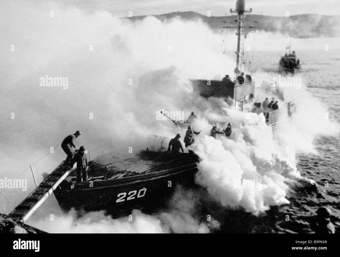 Ships hiding behind a smoke screen after the landing operation Stock ...
