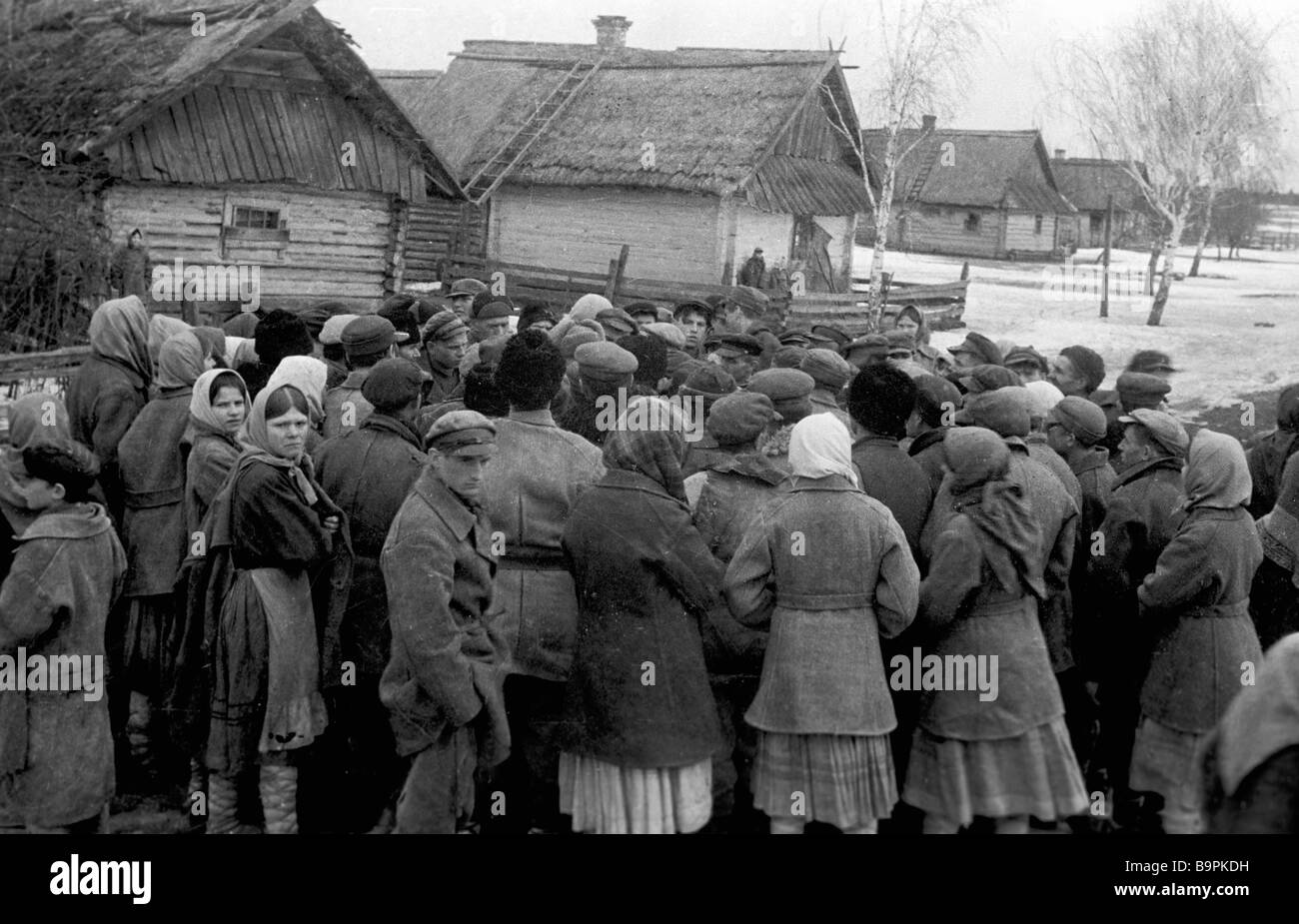 Villagers holding an outdoor meeting Stock Photo - Alamy