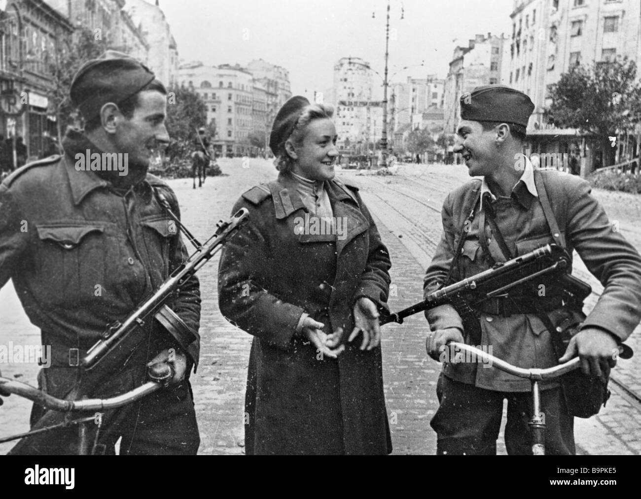 A Russian Red Army woman talking to Yugoslav soldiers Stock Photo - Alamy