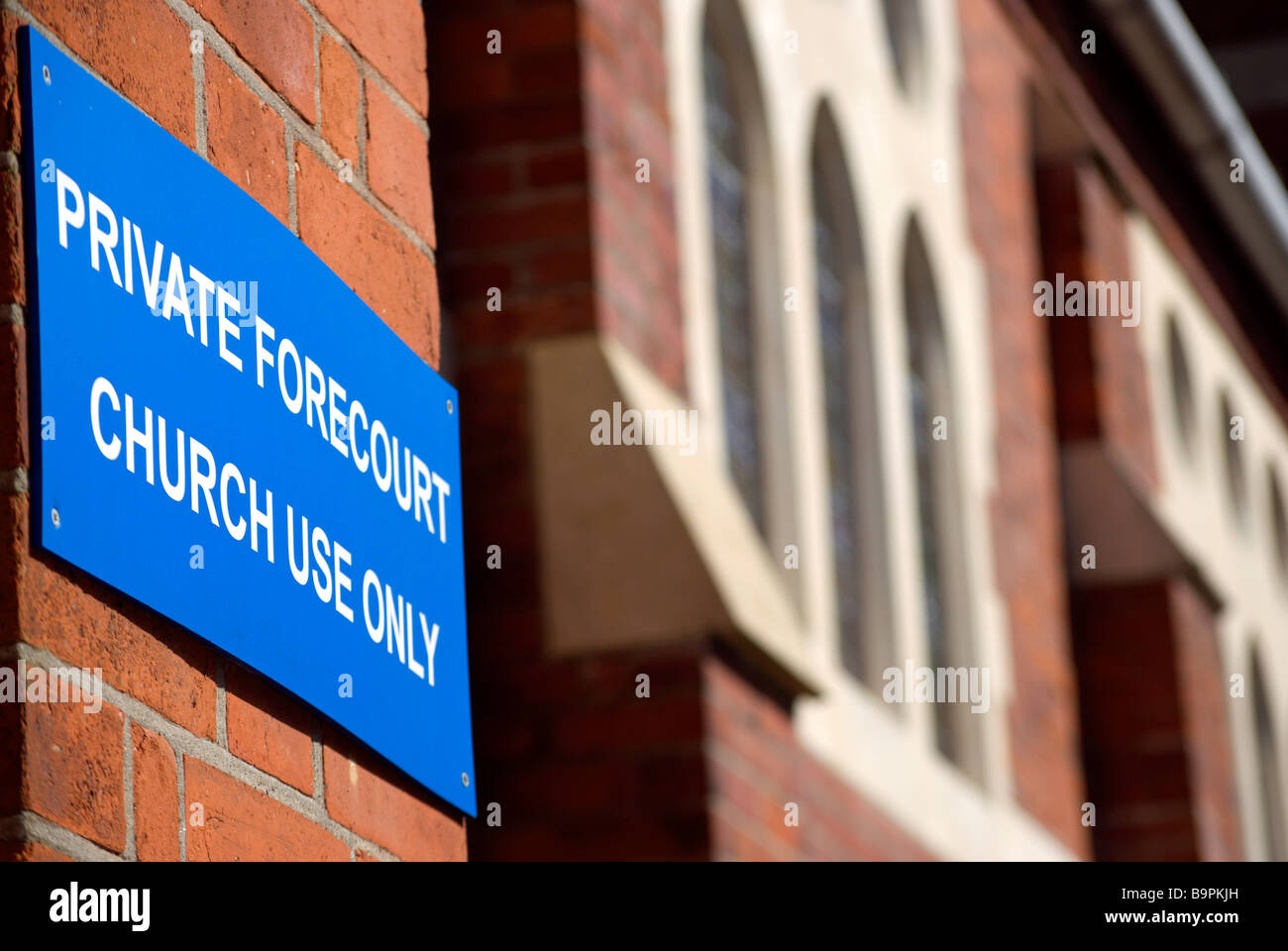 blue and white sign stating private forecourt church use only Stock ...