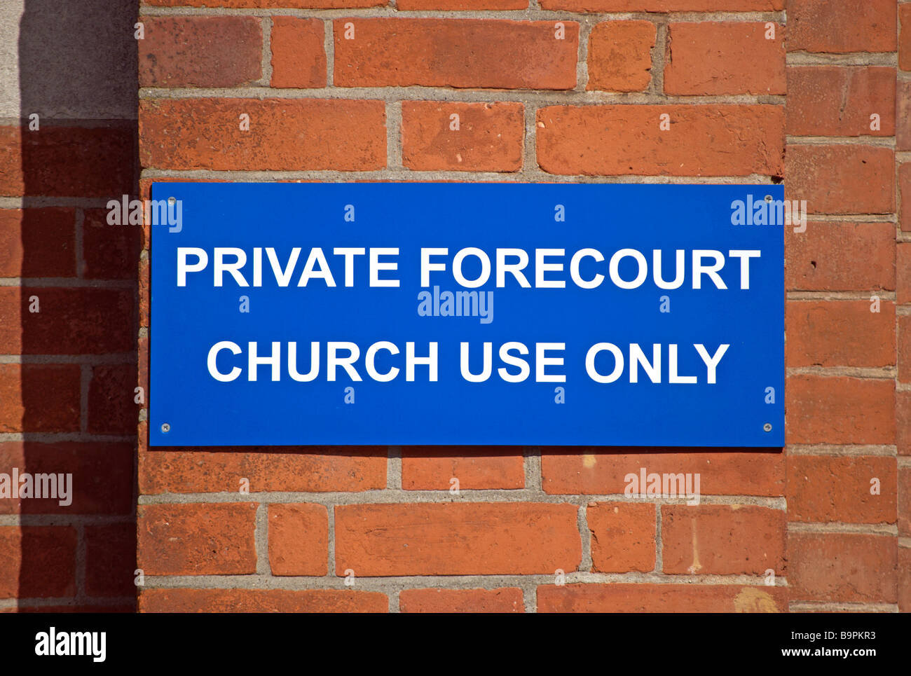 blue and white sign stating private forecourt church use only Stock ...
