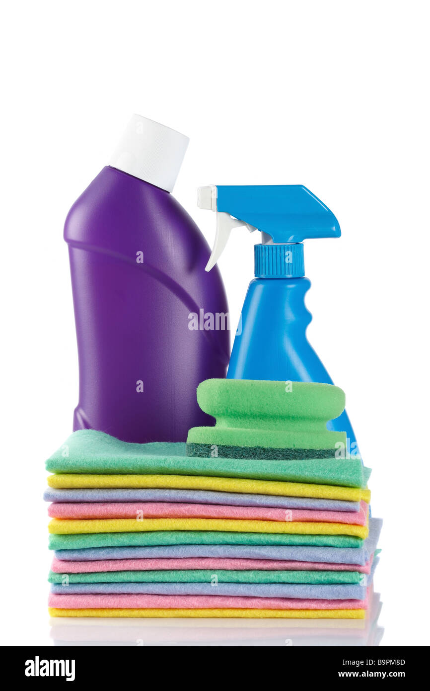 Two plastic detergent bottles and sponges reflected on white background ...