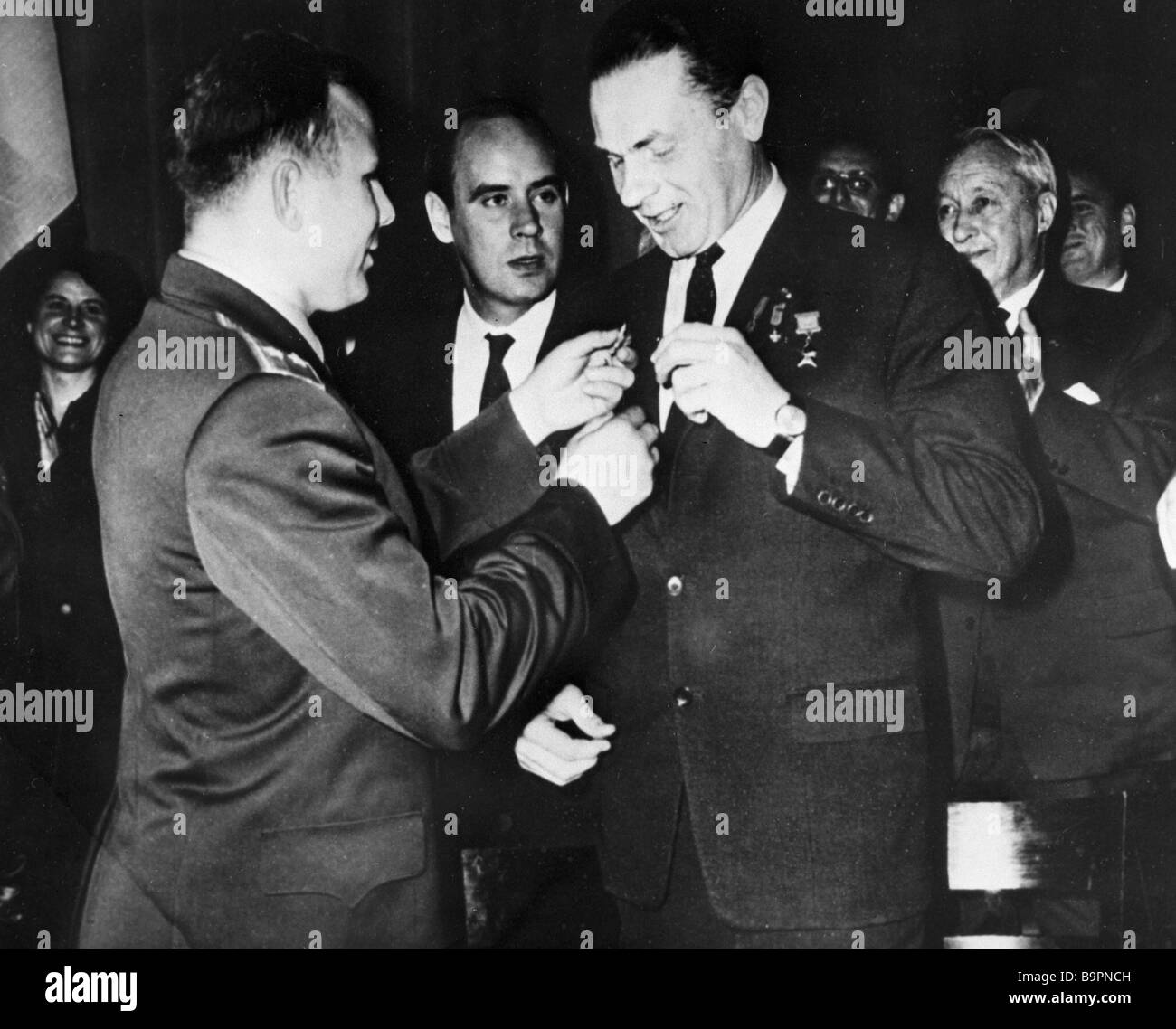 Soviet Pilot Cosmonaut Gagarin left giving a badge to Roland de la ...
