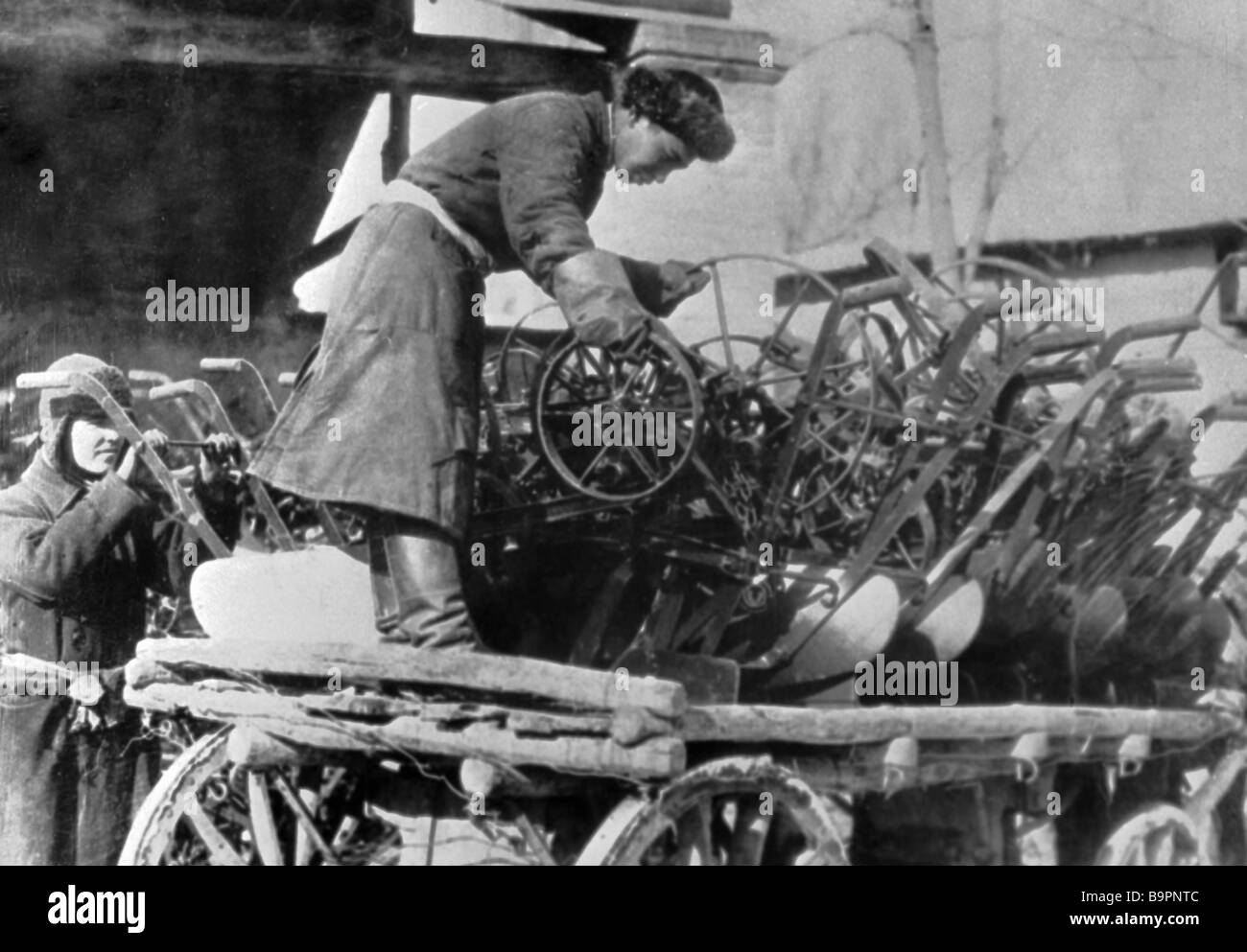 Uzbek peasants share out new farm tools from a batch delivered from ...