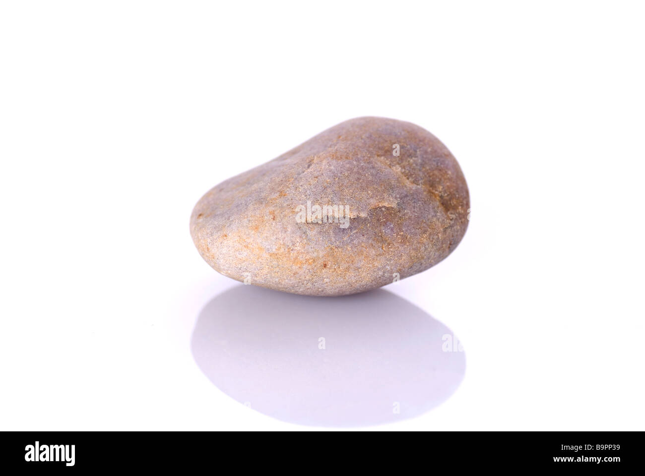 One pebble isolated against a white background Stock Photo - Alamy