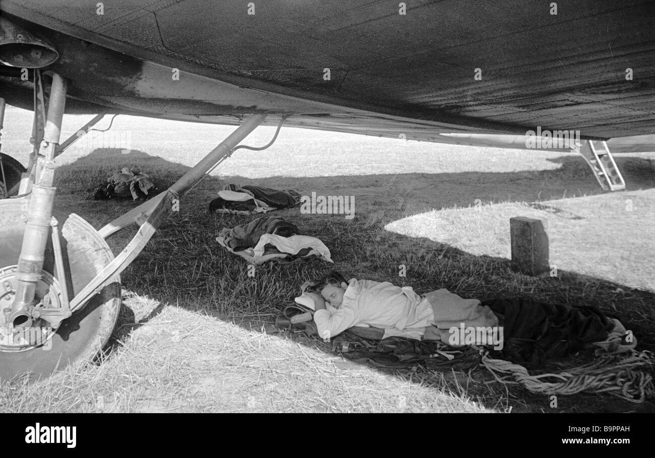 Pilots sleeping on the grass under a plane The 3rd Byelorussian Front ...