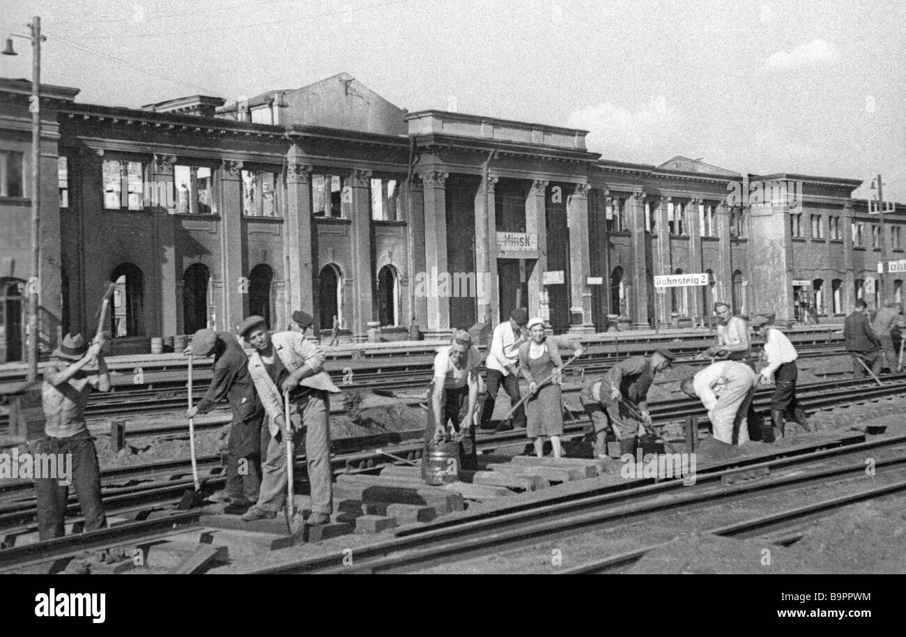 Restoring a railroad track near the Minsk station during World War II ...