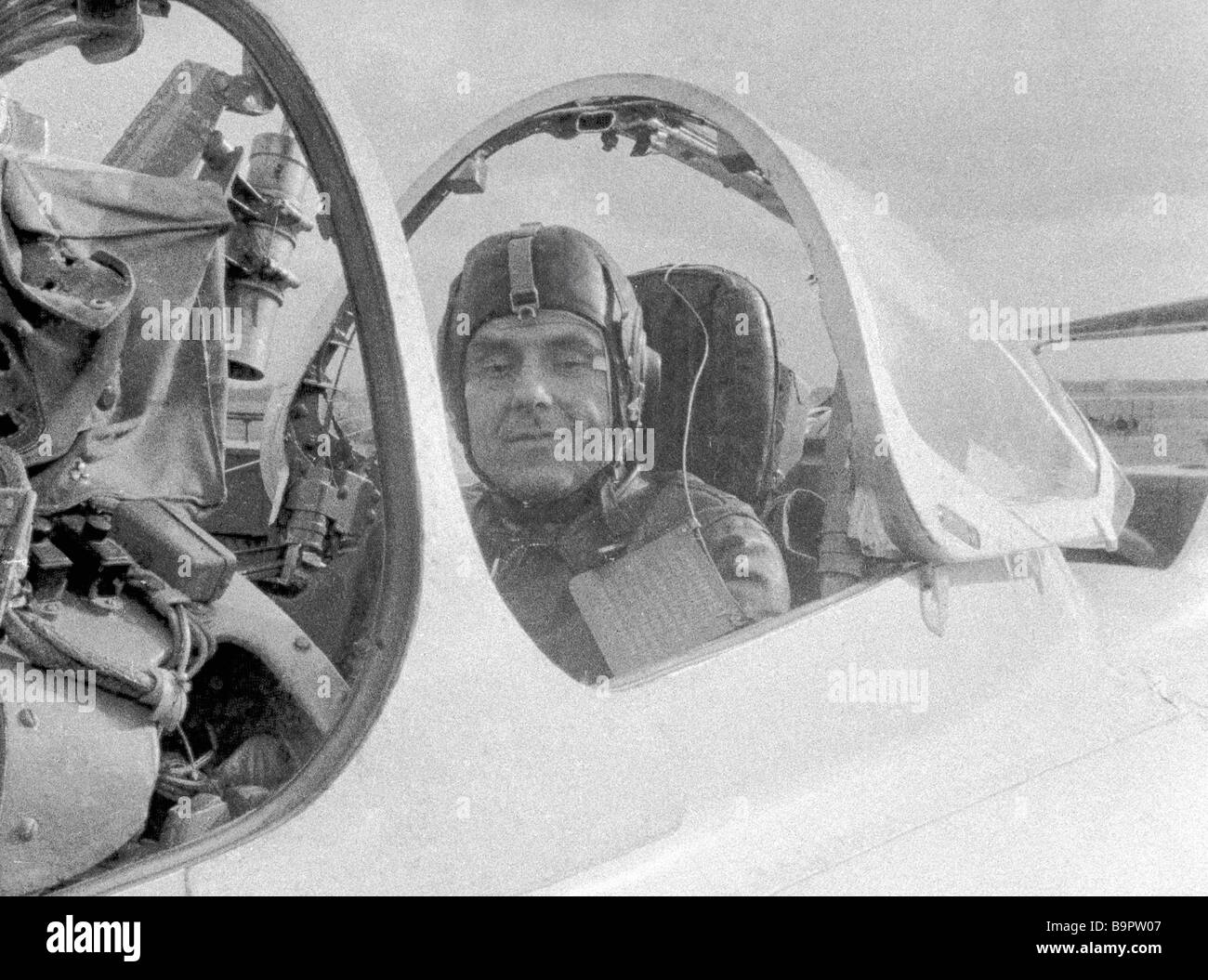 Cosmonaut Vladimir Komarov in the cabin of a jet fighter during ...