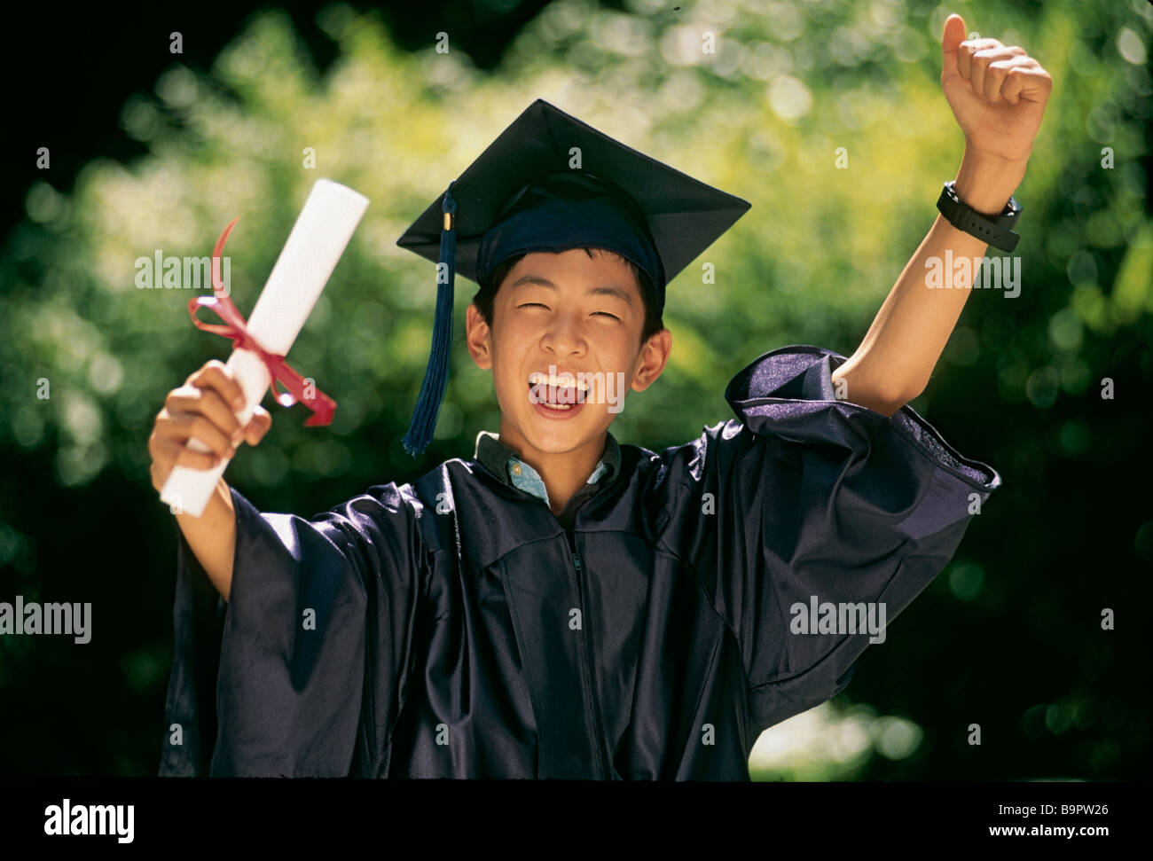 Boy student wearing graduation cap hi-res stock photography and images ...