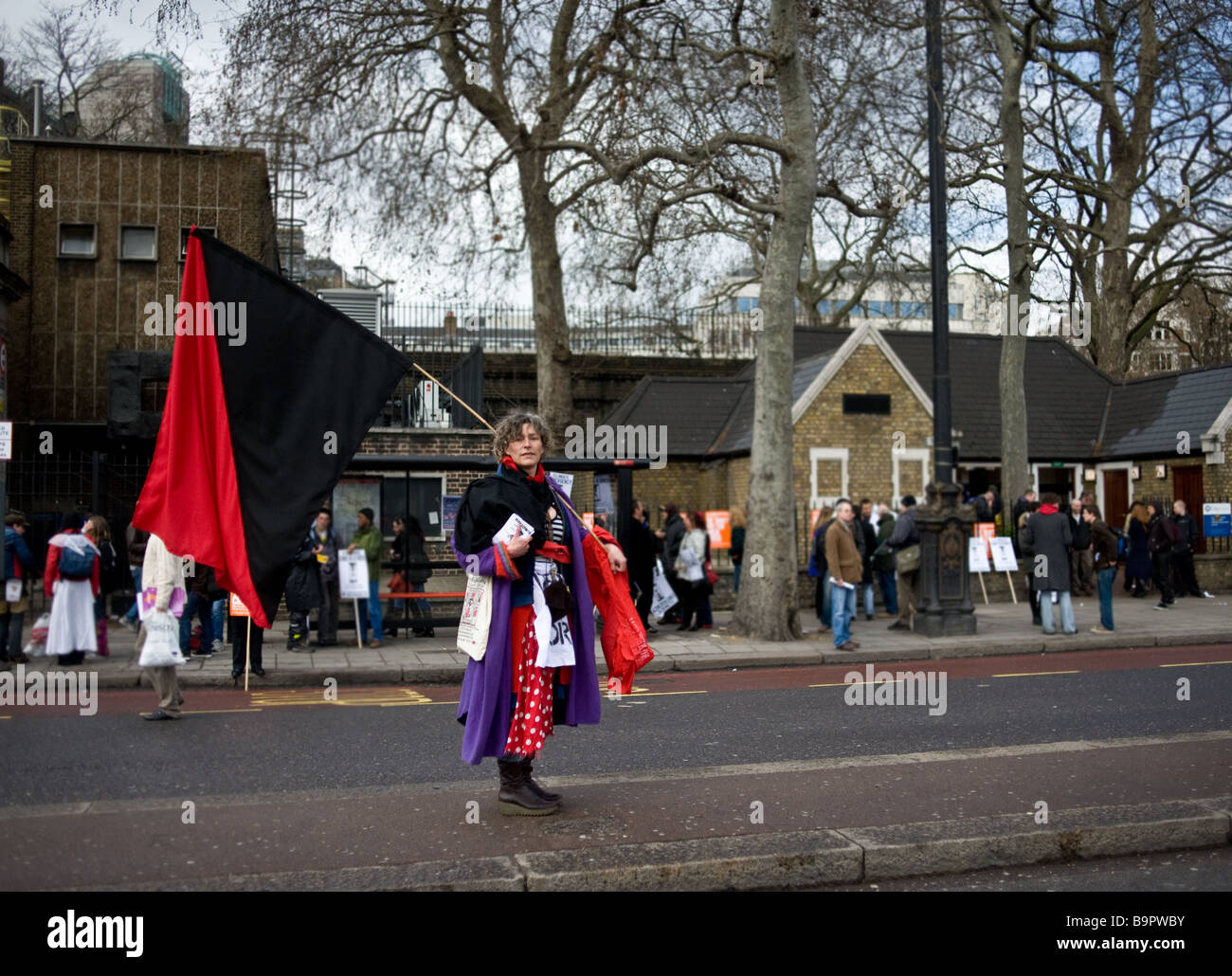 Marina Pepper carrying an anarchist flag at a demonstration Stock Photo ...