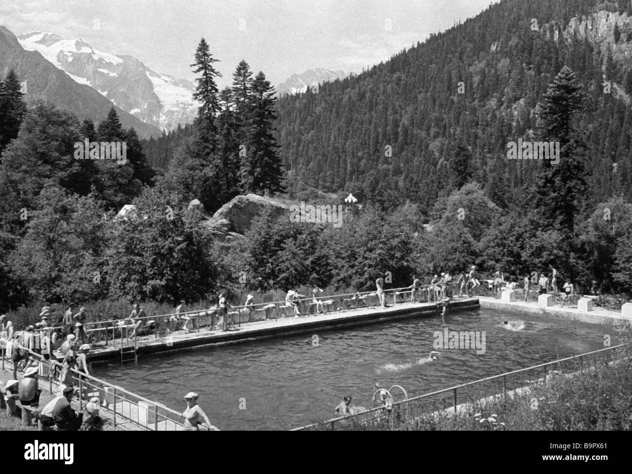 Bathers in the pool of the Red Star mountain climbers camp Stock Photo ...