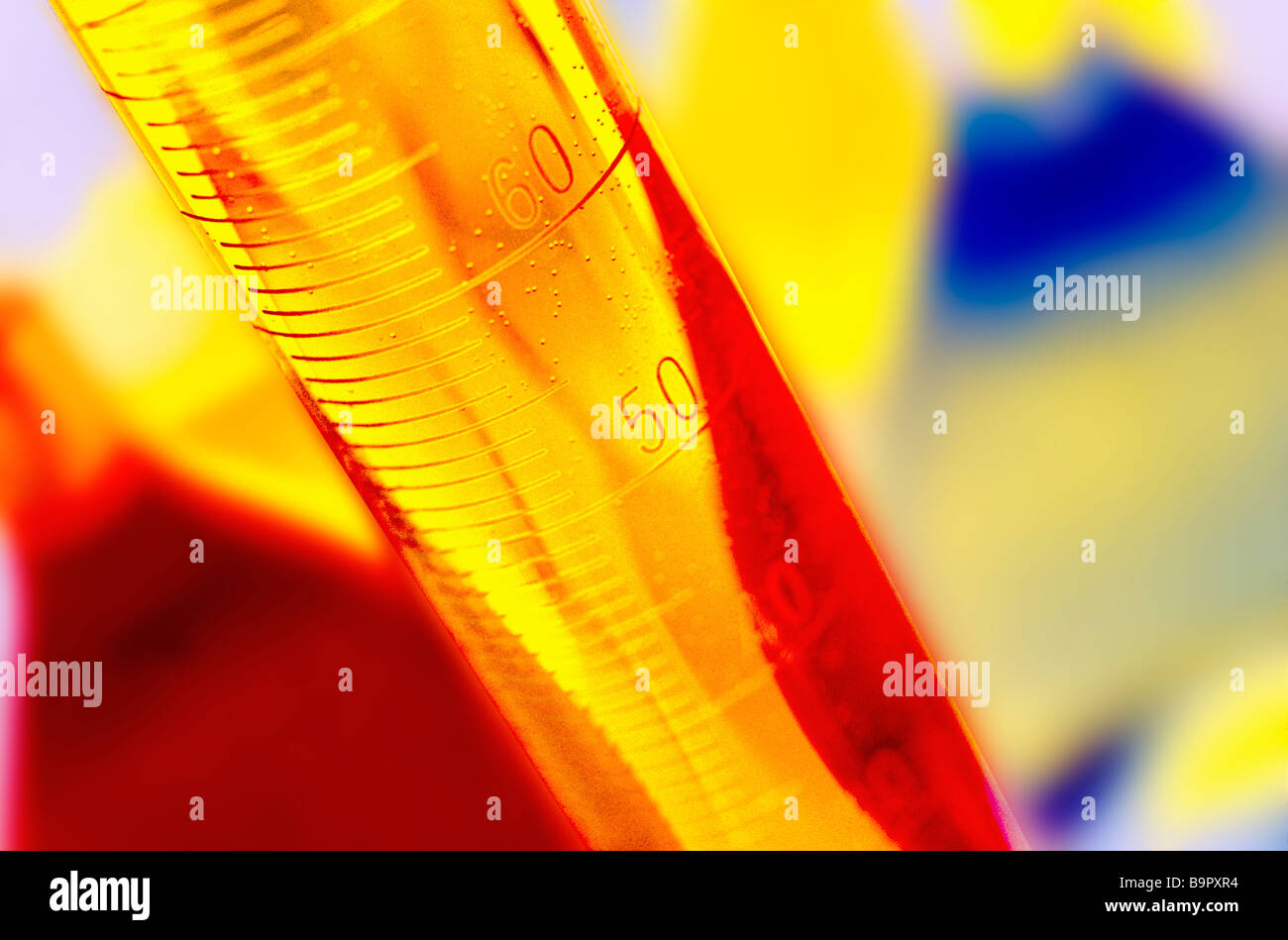 Liquid filled glass laboratory graduated column and flasks used in ...